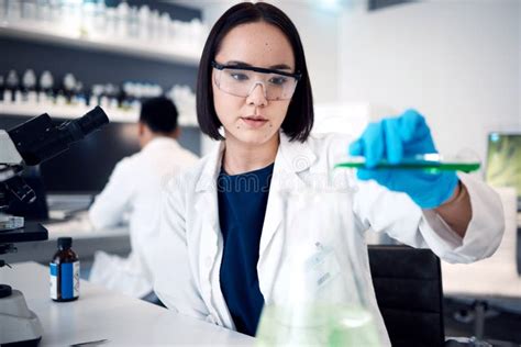 Scientist Woman With Test Tube And Science Test In Lab Chemical Liquid For Experiment And