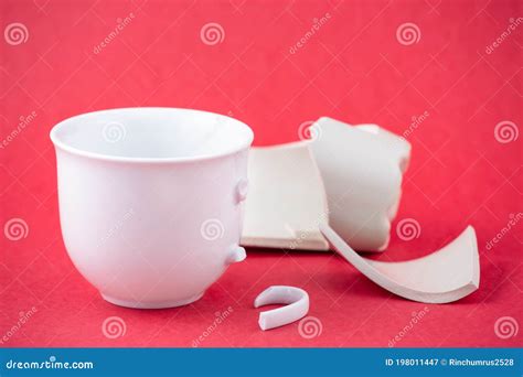 Broken Plate And Dish Or Broken Water Glass On The On The Red