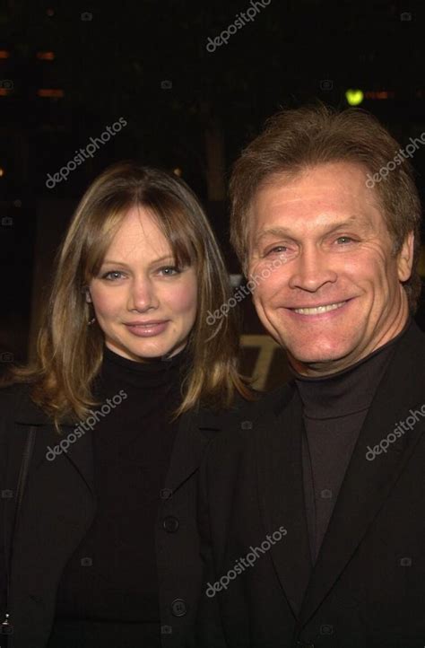 Actor Andrew Stevens And Wife Robyn Pose For Photographers While