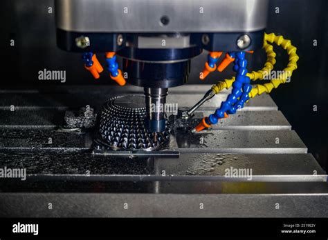 The 5 Axis Cnc Milling Machine Cutting The Automotive Part With Solid Ball End Mill Tool Stock