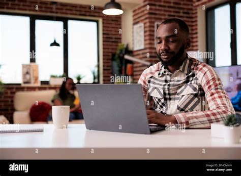 African American Programmer Writing Code Typing On Laptop Keyboard
