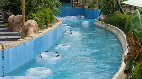 Stockvideo Floats Moving With The Current Of The Empty Lazy River In A Water Park Adobe Stock