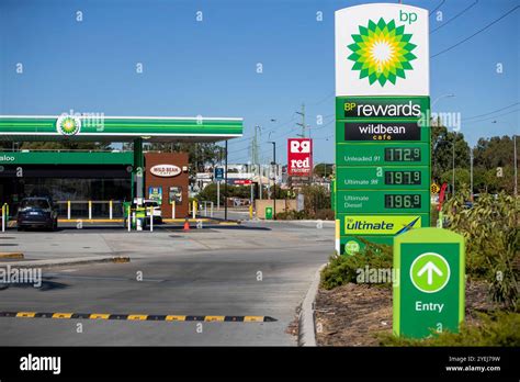 A Bp Gas Station Entrance Featuring A Sign Displaying Current Fuel