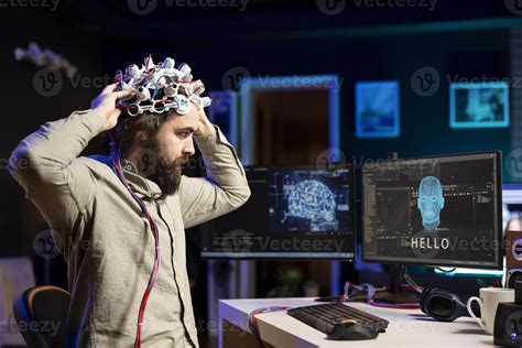 It Specialist Putting Eeg Headset On To Communicate With Artificial
