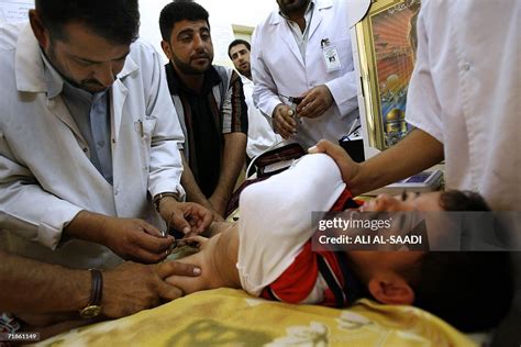 Iraqi Doctors Perform A Circumcision 31 July 2006 At Baghdads Poor