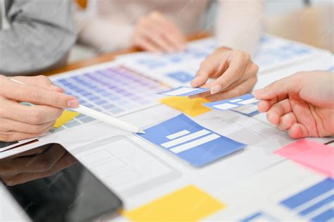Premium Photo Team Of Mobile Application Designer And Developer Are