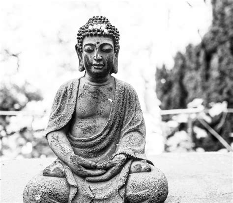 Premium Photo Statue Of Buddha Against Temple
