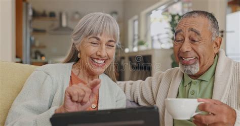 Tablet Laughing And Senior Couple On Couch With Retirement Meme And
