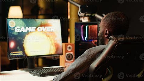 Gamer Losing Intense Singleplayer Spaceship Arcade Racing Videogame Seeing Game Over Screen On