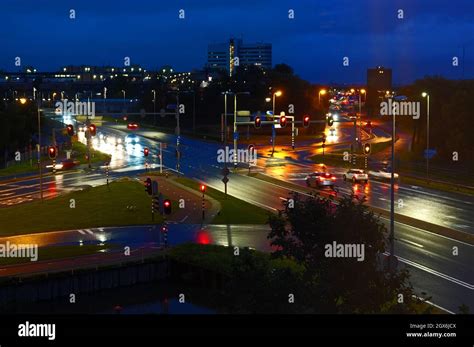 An Intersection In The Netherlands With Traffic Lights And Cars At