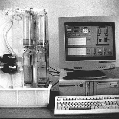 the quadruple tank process shown together with a controller interface