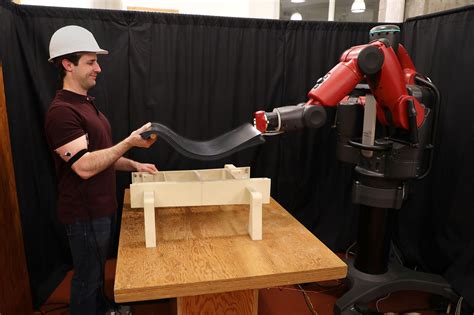 this robot helps you lift objects — by looking at your biceps mit news massachusetts