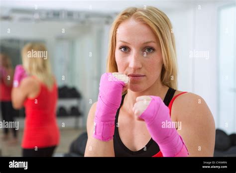 Boxer Holding Fists Up In Gym Stock Photo Alamy