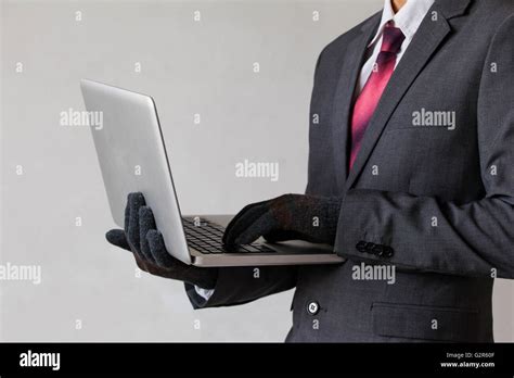 Business Man Wearing Gloves And Using Computer Fraud Hacker Theft Cyber Crime Concept Stock