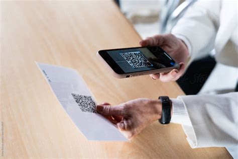Senior Business Woman Reading QR Code Of The Menu Restaurant With Phone By Stocksy Contributor