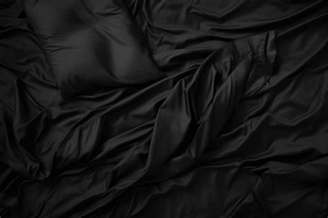 Premium Photo Top View Of An Unmade Black Bed With A Crumpled Sheet And Pillows In The Morning