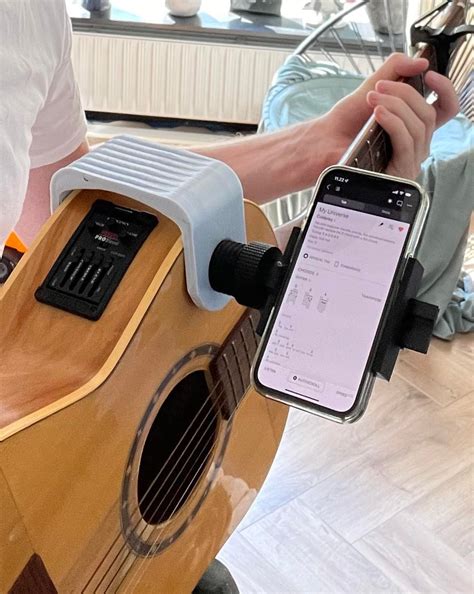 This ingenious guitar phone holder make it easier to use your favorite ...