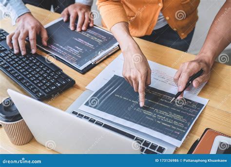 Two Professional Programmer Cooperating And Working On Web Site Project In A Software Developing