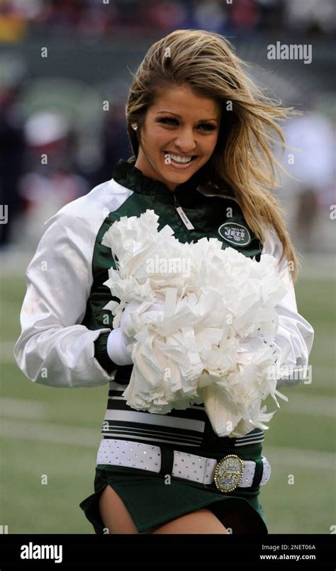 A New York Jets Cheerleader Looks On During The First Quarter Of An Nfl