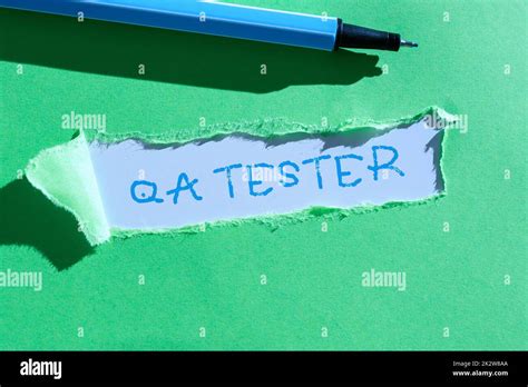 Sign Displaying Qa Tester Word Written On Quality Assurance Of An On Going Project Before