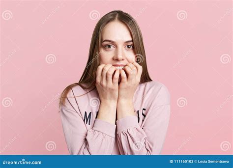 Nervous Embarrassed Worried Woman Looking At Copy Space On Blue