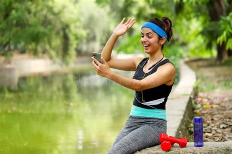 Happy Nice Shape Woman On Video Call Saying Hello At Phone Camera Stock