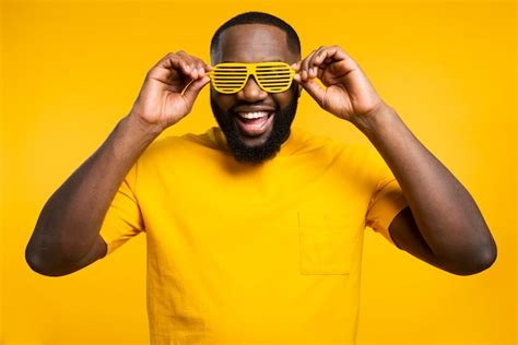 Free Photo Man Putting On Sunglasses
