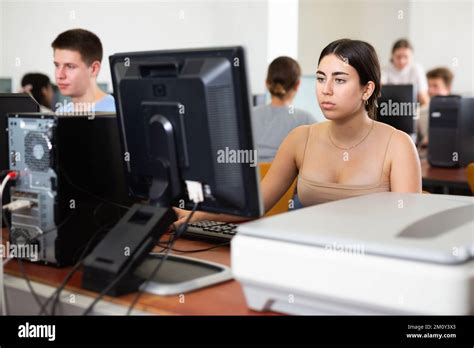 Teenage Girl Learning To Use Personal Computer During Lesson Stock Photo Alamy