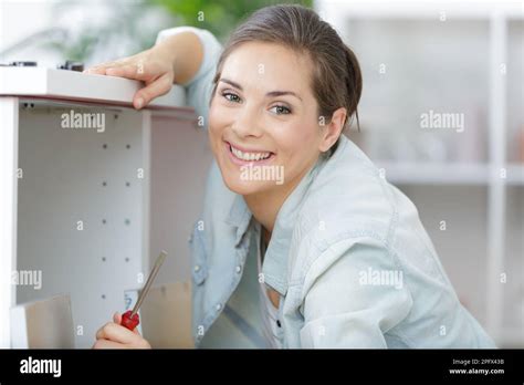 Woman Putting Together Self Assembly Furniture Assemble Flat Pack Stock Photo Alamy