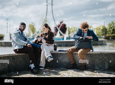 Diverse Business Team Discusses Project Outdoors Analyzing Data And Brainstorming Ideas By