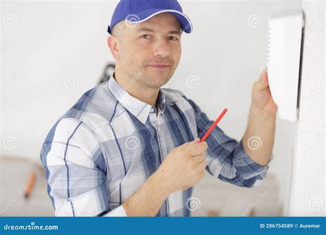 Man Electrician Installing Intercom On Wall Stock Image Image Of