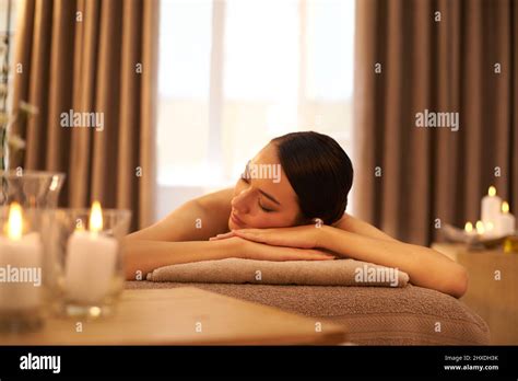 Time To Unwind A Beautiful Young Woman Relaxing On A Massage Table