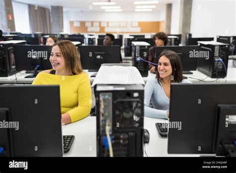 Young Students Listening A Lecture Inside University Classroom