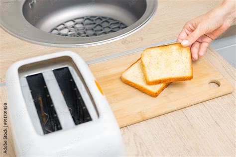 Housewife Frying Bread In A Toaster In The Kitchen Woman Making Toast Bread For Toast Toast