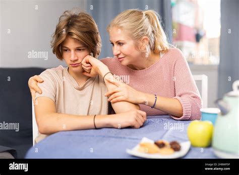 Mother And Son Sitting After Quarrel At Home Stock Photo Alamy