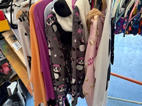 New Clothes Bundles And Rack To Hold Them Mostly Scrubs But Also Some