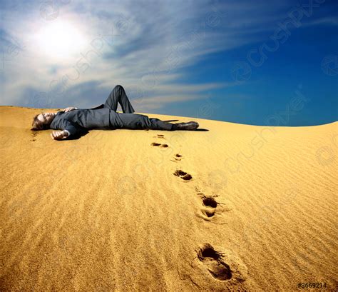 Dead Business Man In The Desert Stock Photo Crushpixel