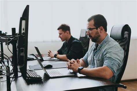 Premium Photo Portrait Of Two Professional Male Programmers Working