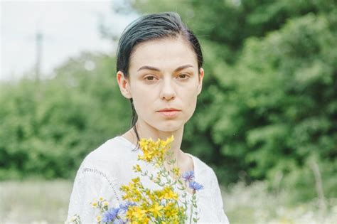 Premium Photo Beautiful Girl Among The Summer Field With Wildflowers