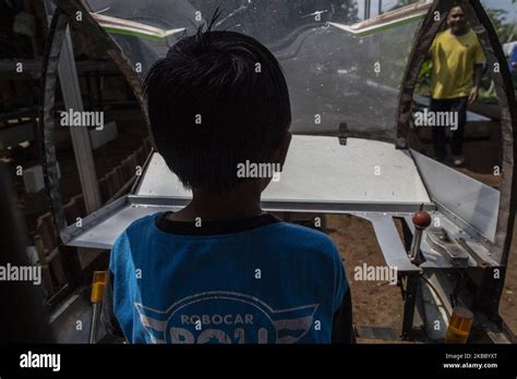 Jujun Junaedi With His Young Son Dede Rafka Assistant Build A