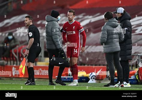 Liverpools Jordan Henderson Is Checked By Medical Staff After Picking
