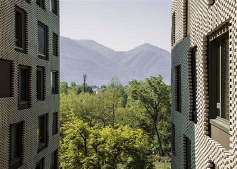 Brick Pixel Patchwork Envelops Housing By Buzzi Studio Di Architettura