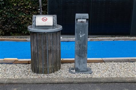 Dual Purpose Trash And Cigarette Waste Bin Placed On Gravel Stock Image