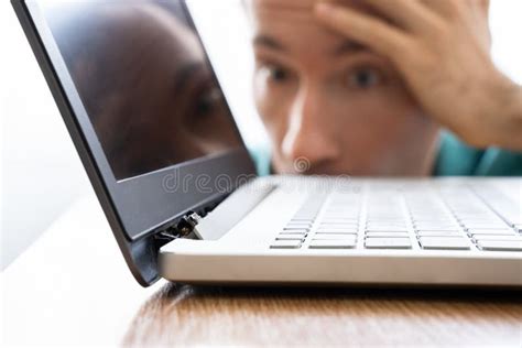 Man Looking At Damaged Laptop Computer Stock Photo Image Of Industry Black 182250046
