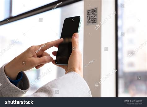Woman Scanning Qr Code Her Smartphone Stock Photo Shutterstock