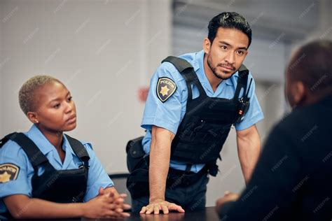 Premium Photo Interrogation Arrest And Police Team With A Suspect For