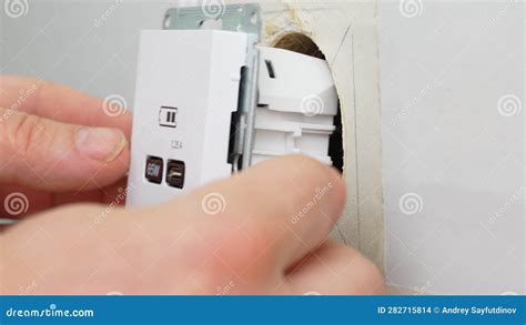 Installation Of A USB Type C Socket At The Head Of The Bed For Charging Devices Stock Photo