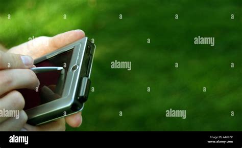 Man Using PDA Stock Photo Alamy
