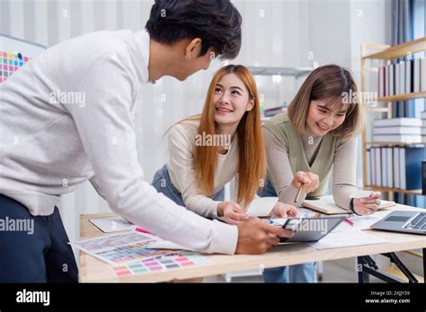 Creative Team Collaborating On Ux Ui Design Project In Modern Office
