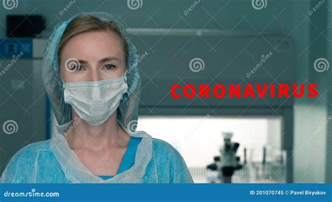 Woman Microbiologist Posing On The Background Of Medical Laboraty Stock